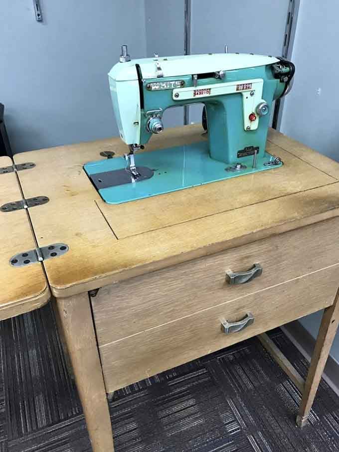 That turquoise sewing machine is pure vintage charm, a functional piece of history ready for its next project.