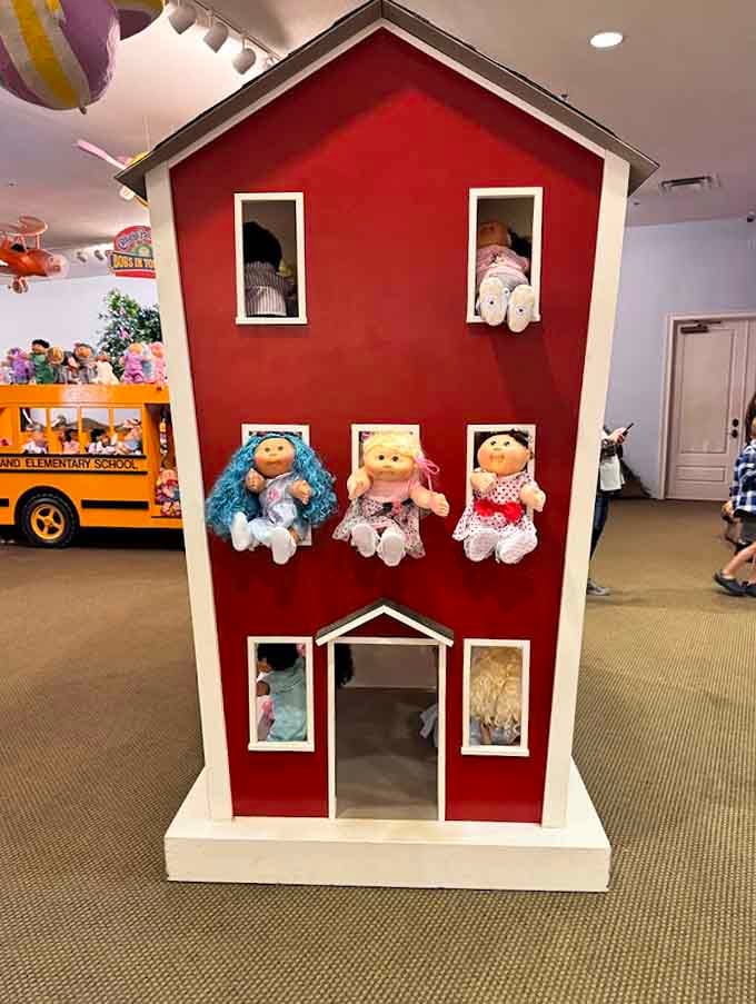 A dollhouse taller than most adults, proving that everything here operates on a different scale of reality and whimsy.