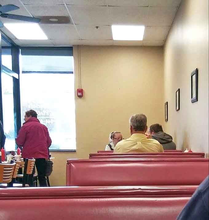 Locals gathering in booths, sharing coffee and conversation, because great diners are community centers that happen to serve food.