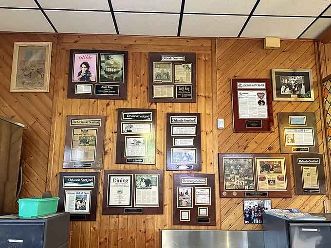 Framed newspaper clippings and accolades cover the walls, testament to decades of satisfied customers and legendary sandwiches.