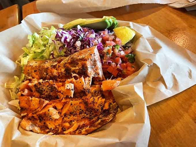 Charbroiled salmon that looks like it was swimming this morning. Fresh, perfectly seasoned, and served with actual vegetables for balance.