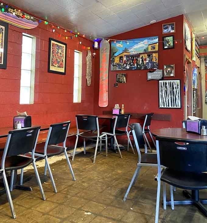 Red walls adorned with pop culture treasures create a dining room that's equal parts museum and comfort zone.