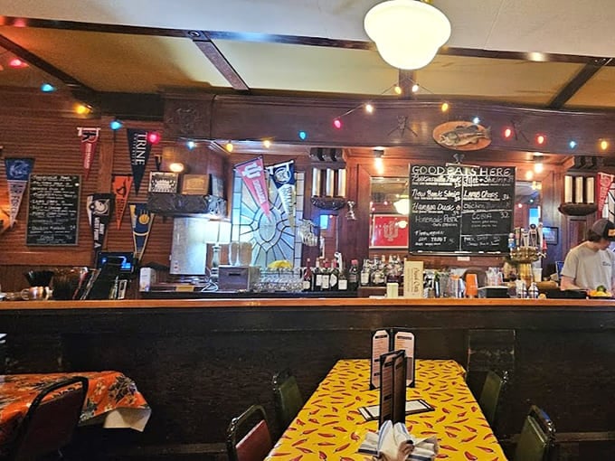 The bar area showcases an impressive selection, proving this tavern takes its beverages as seriously as its food always.