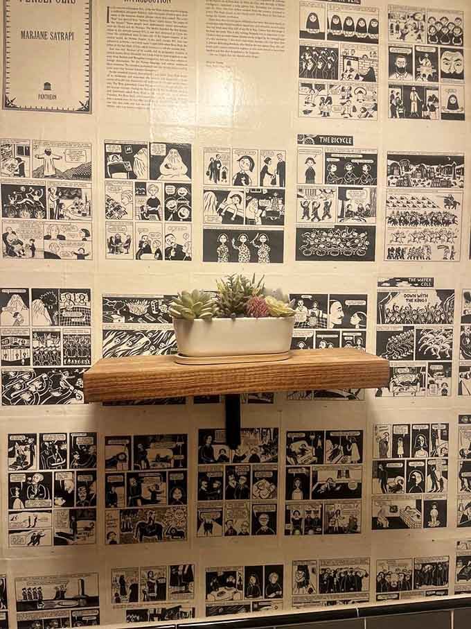 Comic strip wallpaper in the restroom proves that even bathroom breaks deserve a good story here.