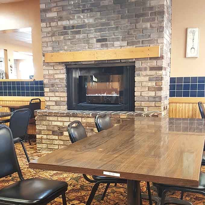 A brick fireplace adds warmth and character, making this cafe feel like your favorite relative's dining room, only better.