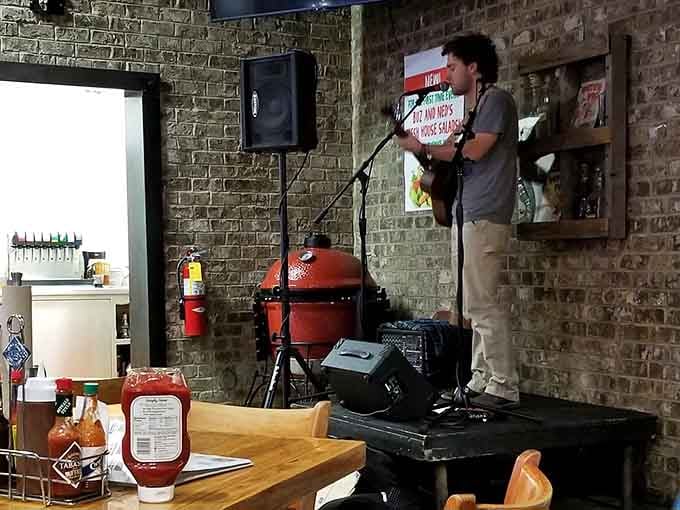 Live music and a big red smoker create the perfect backdrop for your barbecue experience. Entertainment included, folks.