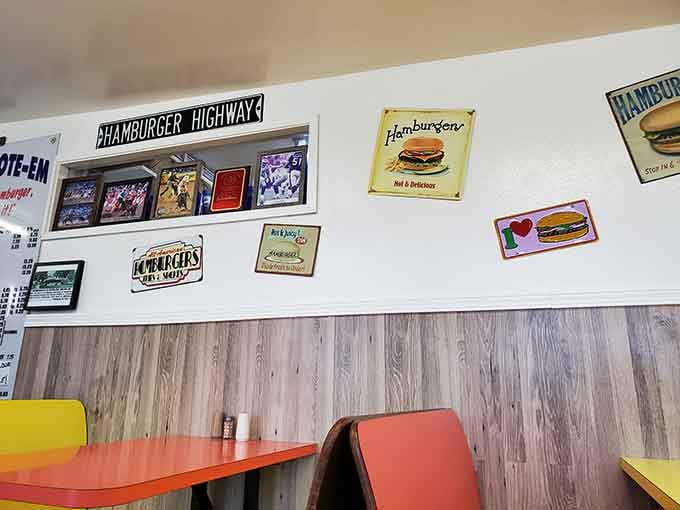 Vintage signs and burger memorabilia line the walls, creating a nostalgic atmosphere that feels like visiting a delicious museum.