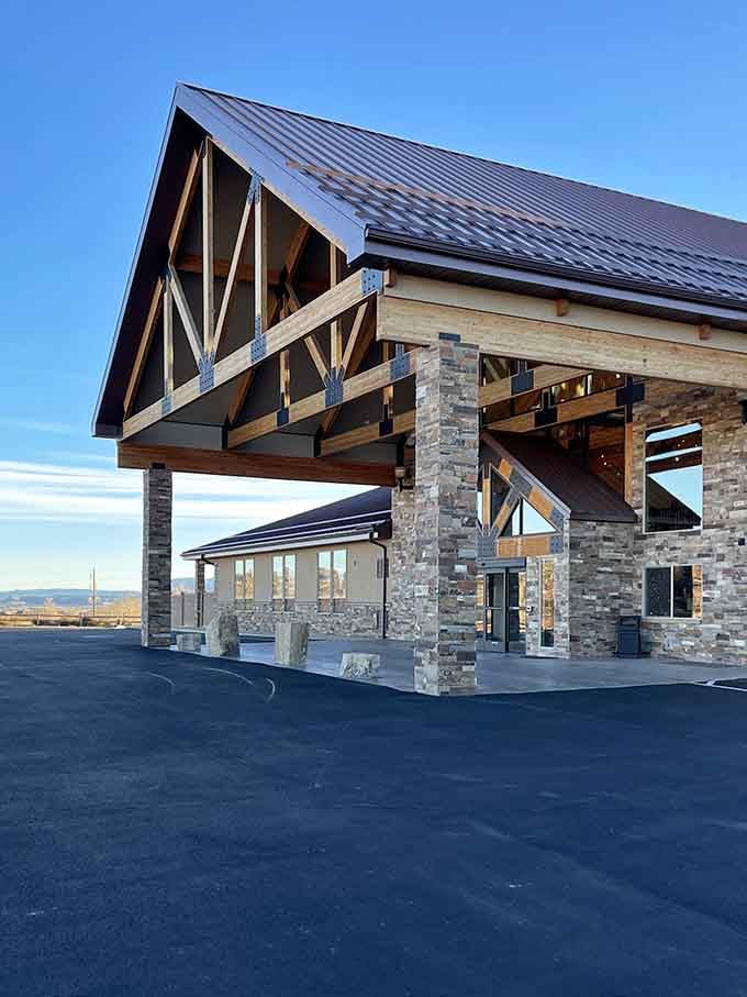 Timber beams and stone pillars create a grand entrance worthy of the spectacular landscapes that surround it. First impressions matter, even in the wilderness.