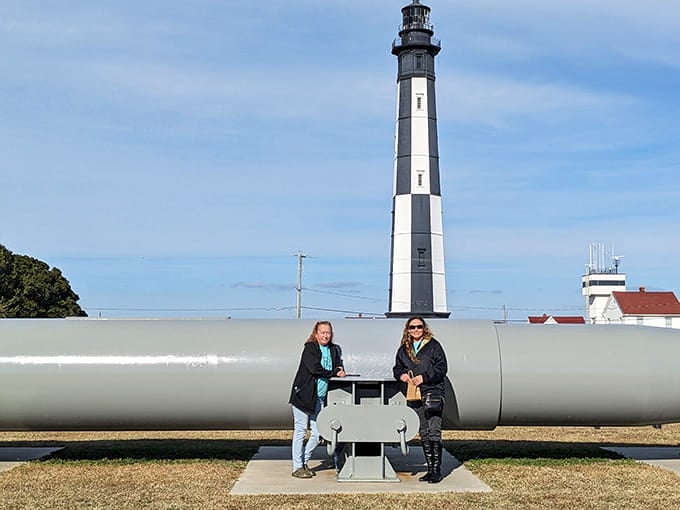 Visitors pose with the cannons, adding their own small moment to a site where history has been made for over 400 years.