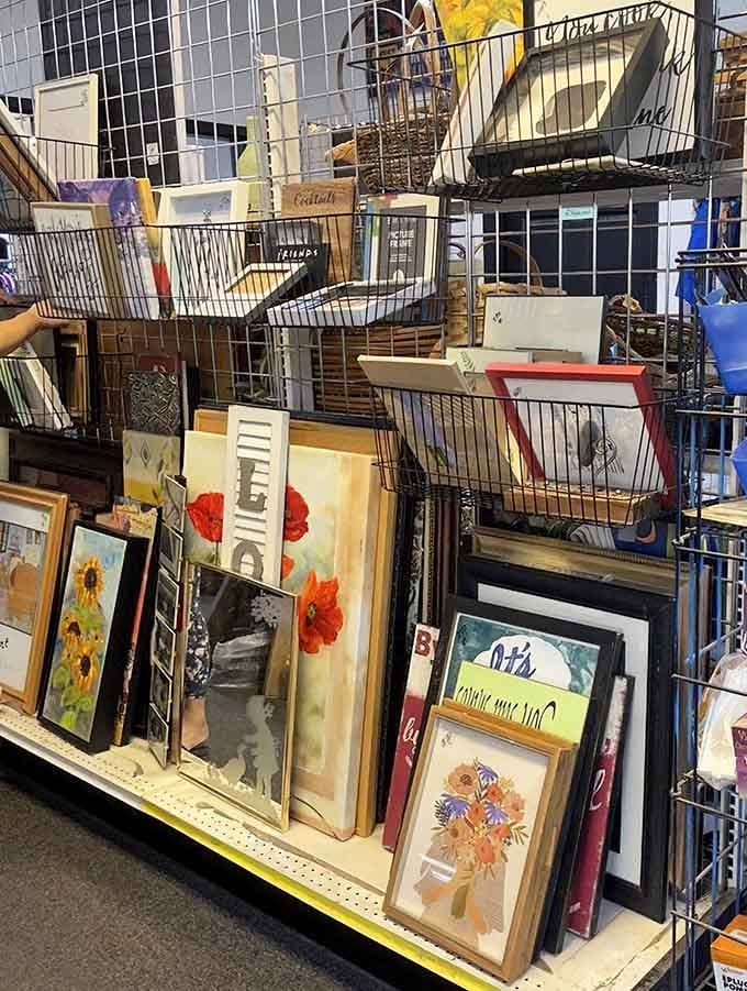 Framed artwork stacked like a gallery waiting to happen, because bare walls are just opportunities you haven't seized yet.