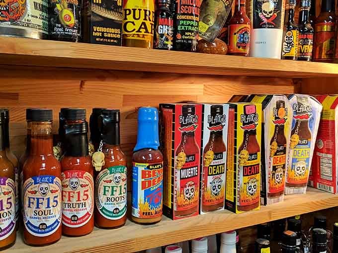 Hot sauce bottles lined up like spicy soldiers, ready to add heat to your next cookout.