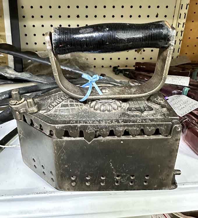 An antique charcoal iron that made laundry day an actual workout – no gym membership required back then.