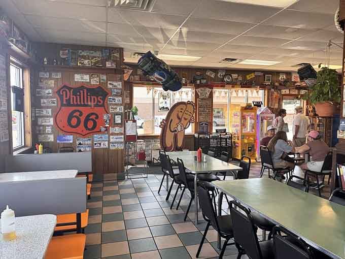 Orange booth seats and checkered floors create the kind of authentic diner vibe money can't fake today.