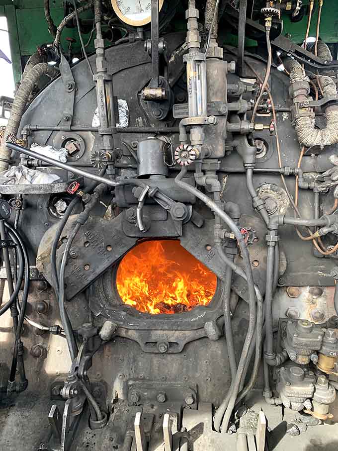 The firebox glows with coal-fed flames, providing the raw power that transforms water into steam and steam into motion.