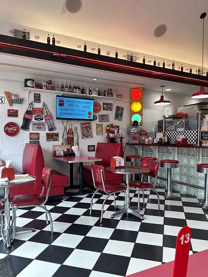 Coca-Cola memorabilia and a working traffic light, because why shouldn't your dining experience include vintage Americana and street signals?