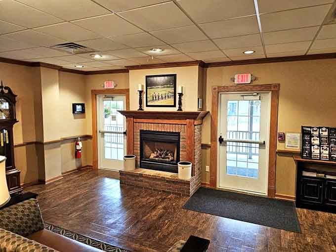 A brick fireplace adds warmth to the entrance, because nothing says welcome home quite like actual fire and hospitality.