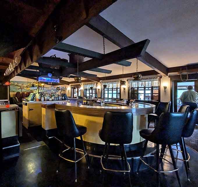 The bar beckons with dark wood and comfortable stools, promising conversations that last longer than your dinner reservation.