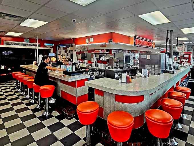 The counter where magic happens, complete with red stools that have supported countless happy customers over the decades.