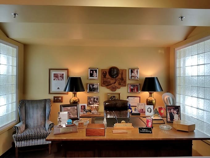 This recreated executive office proves that running a soda empire required a big desk, family photos, and presumably unlimited free samples.