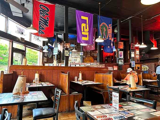 College banners hang overhead like barbecue blessings, watching over diners as they tackle slabs and contemplate seconds.