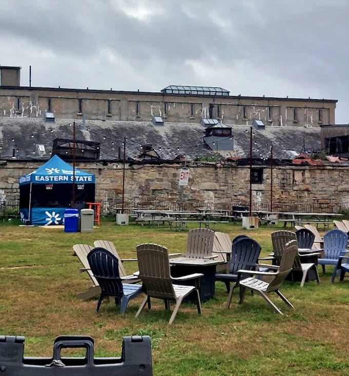 The outdoor courtyard offers a brief respite from the oppressive interior, though those towering walls remain ever-present.