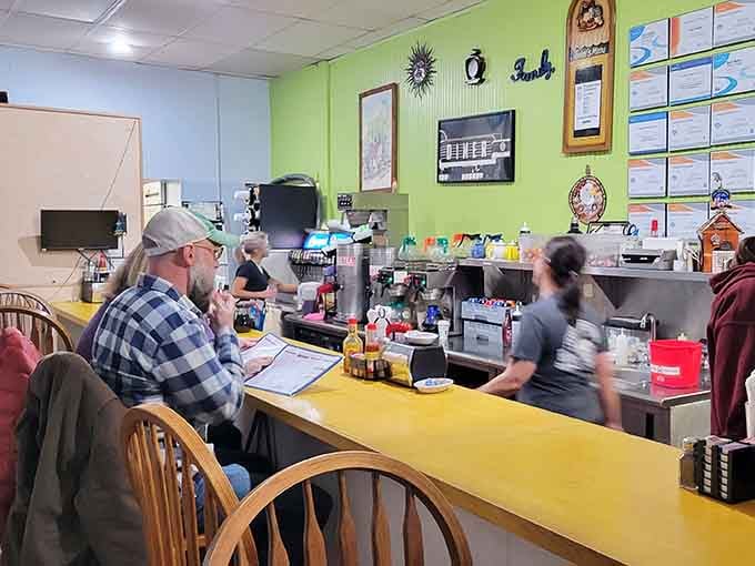 The counter seating offers front-row views of the kitchen magic, where breakfast miracles happen in real time every morning.