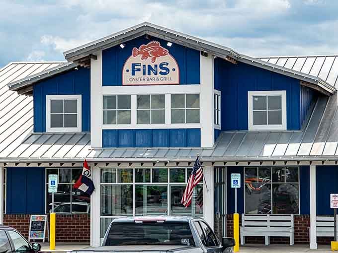 FINS Oyster Bar & Grill brings coastal flavors inland, its bright blue exterior as inviting as the promise of fresh seafood without having to shake sand out of your shoes.