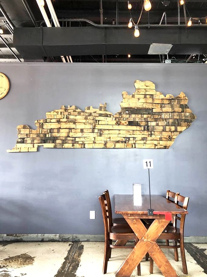 A wooden Kentucky outline on the wall, crafted with the same care they put into smoking brisket.