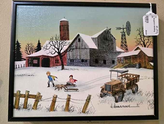 Framed artwork capturing simpler times when barns were picturesque and winter meant actual sledding, not just complaining.