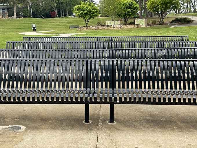 These distinctive metal benches offer front-row seating to nature's daily show, no ticket required for the performance.