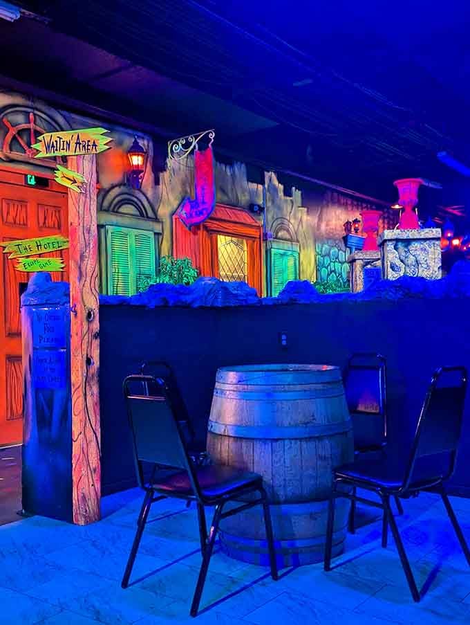 The waiting area proves that even standing around can be an adventure under blacklight conditions.