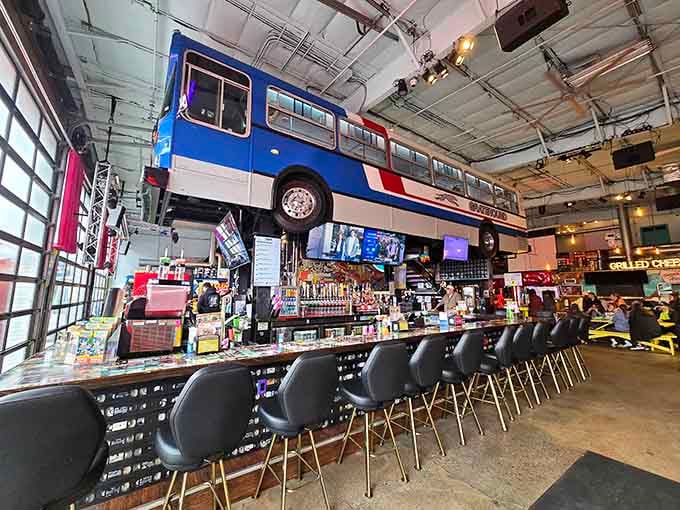 A full-sized bus hangs overhead at the bar, proving this place doesn't do anything halfway or boring.
