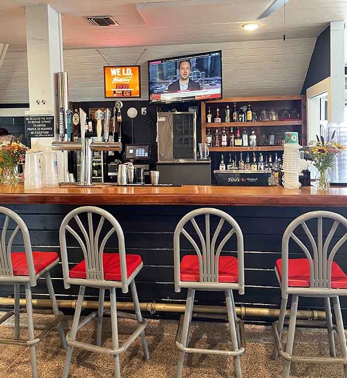 The bar beckons with cold drinks and good company, perfect for waiting or celebrating your crab conquest.