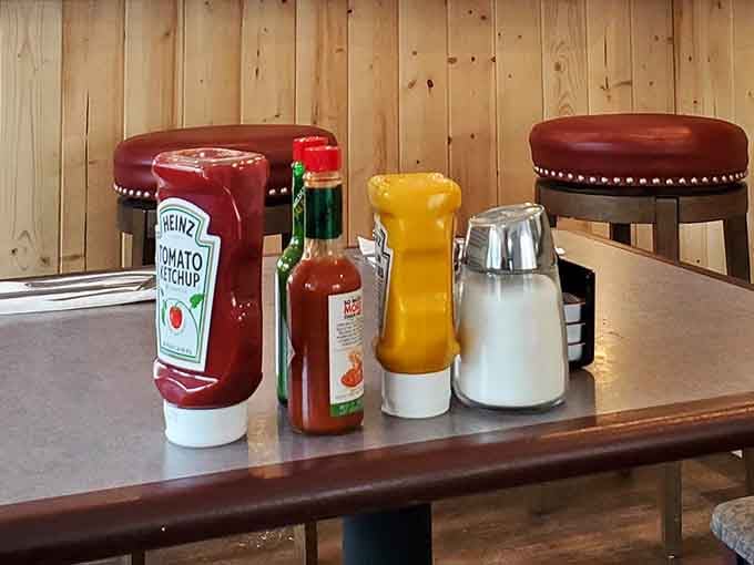 The holy trinity of table condiments, ready and waiting like old friends at every booth and table.
