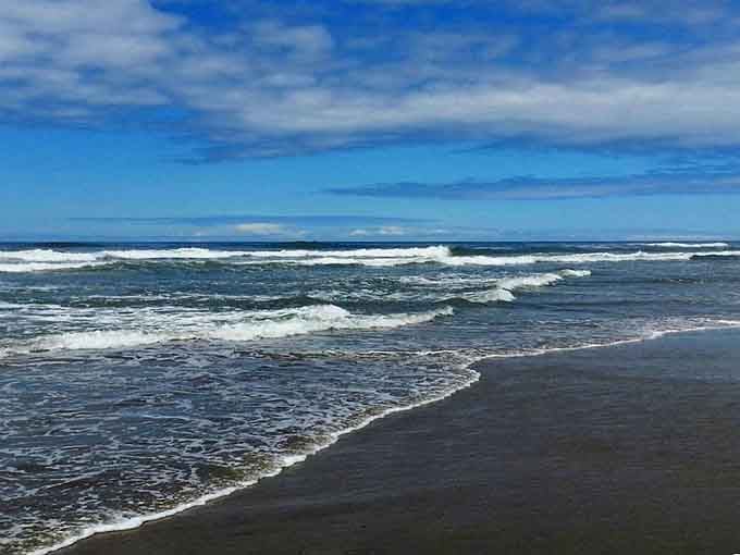 The beach at trail's end rewards your half-mile journey with waves, sand, and the satisfaction of adventure completed.