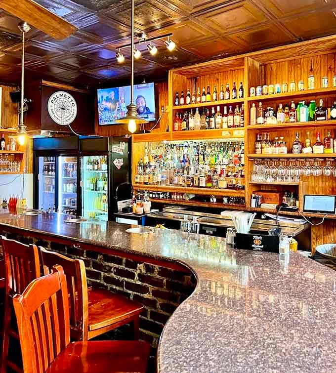 The well-stocked bar stands ready to mix whatever beverage pairs perfectly with your chosen seafood feast today.