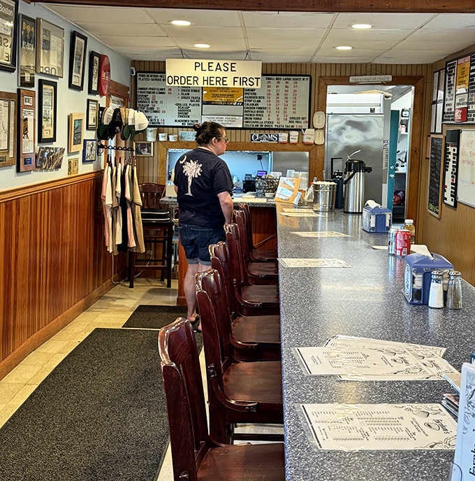 The counter seating where coastal breezes complement every crispy, delicious bite perfectly.
