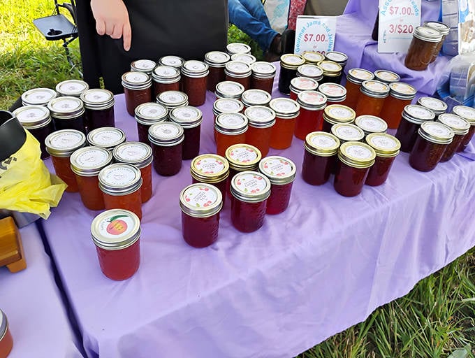 Homemade preserves lined up like jewels &ndash; each jar capturing summer's essence to brighten winter toast for months to come.
