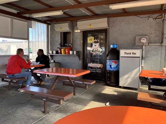 The covered outdoor seating area: not fancy, but perfectly functional for devouring your sandwich in peace.