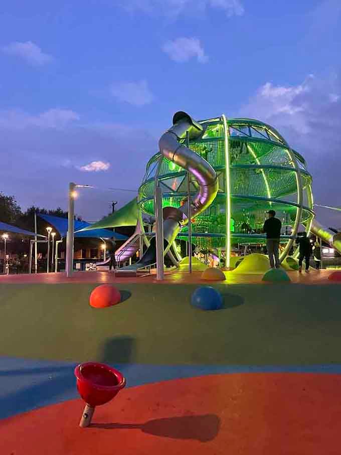The dome glows green at twilight, transforming into a magical beacon that makes leaving nearly impossible for excited children.