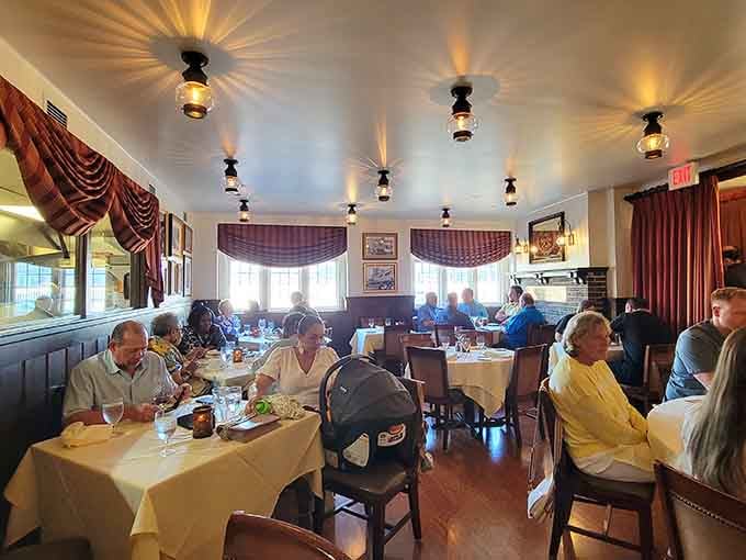 White tablecloths and comfortable seating create an environment where lingering over dinner isn't just allowed, it's practically mandatory.