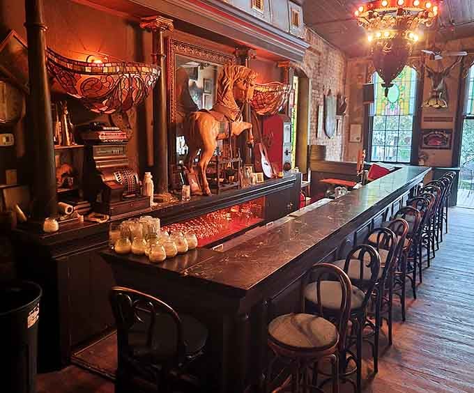 That long wooden bar has served more drinks than you've had hot dinners, and it shows beautifully.