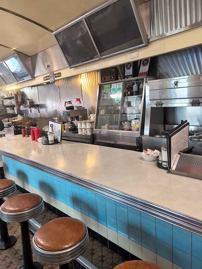 The view from the counter puts you front row for the breakfast theater, where every order is opening night.
