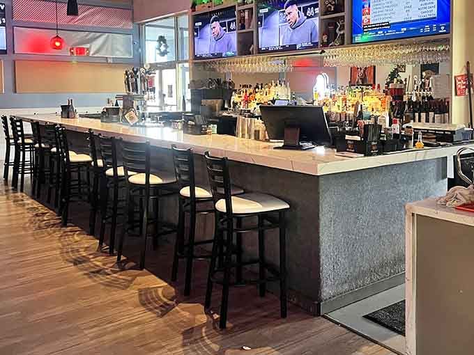 The bar area gleams with promise, offering everything from morning coffee to celebratory cocktails throughout the day.