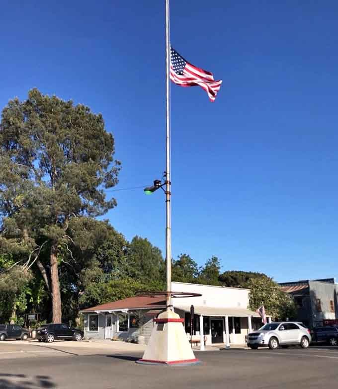 This historic flagpole stands proud in the town center, a reminder that some traditions are worth keeping around.
