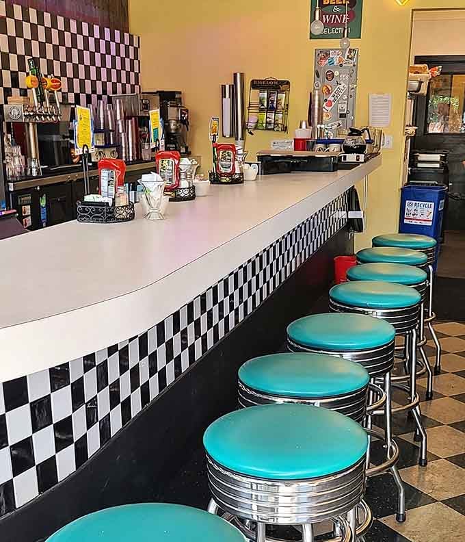 That counter seating lineup looks like it's been waiting decades for you to slide onto a stool and order coffee.