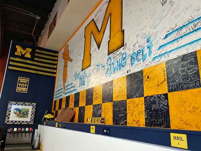 Walls adorned with checkered patterns and fan signatures, turning a simple deli into a living scrapbook of community love.