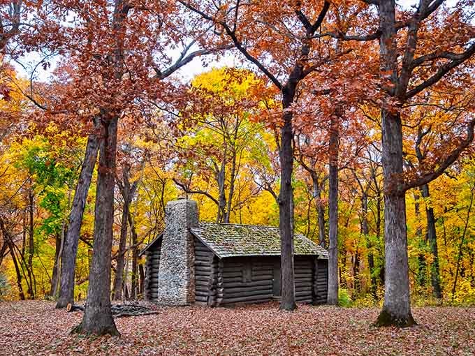 This cozy cabin nestled in autumn colors looks like the setting for every heartwarming holiday movie ever made.