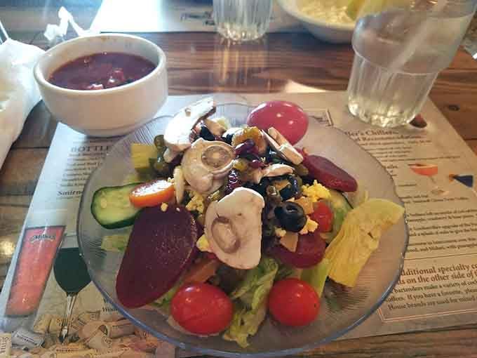 This colorful salad topped with beets, mushrooms, and eggs offers a brief intermission from the main attractions.