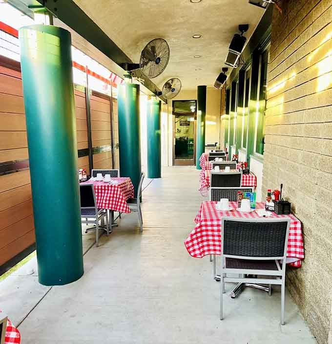 Red checkered tablecloths on the patio make every meal feel like a picnic without the ants.